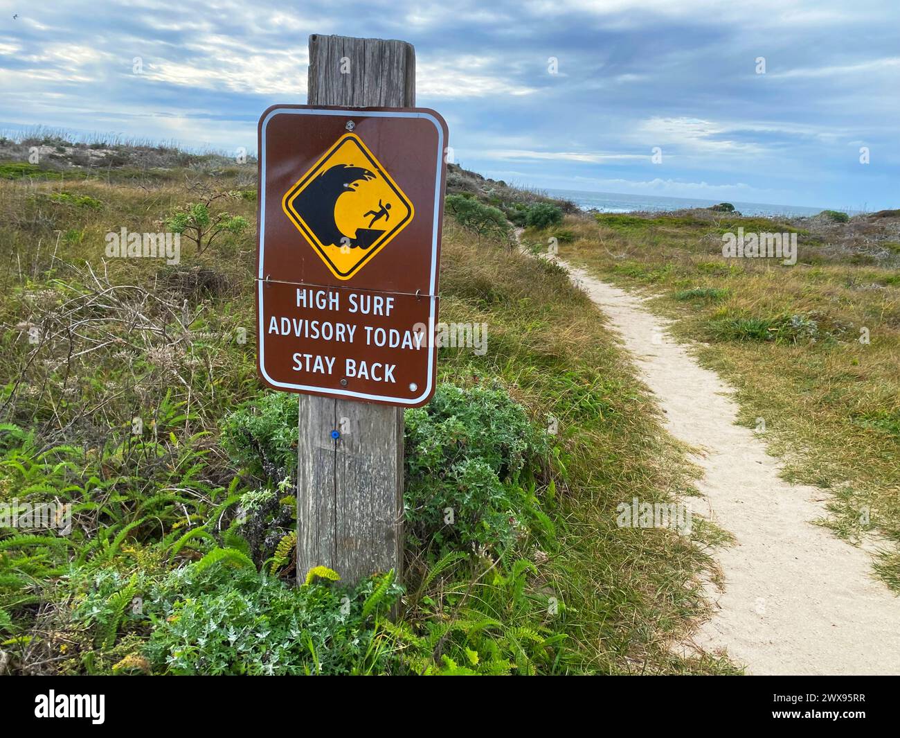 Sign reading "High Surf Advisory Today - Stay Back." Warning sign of ...