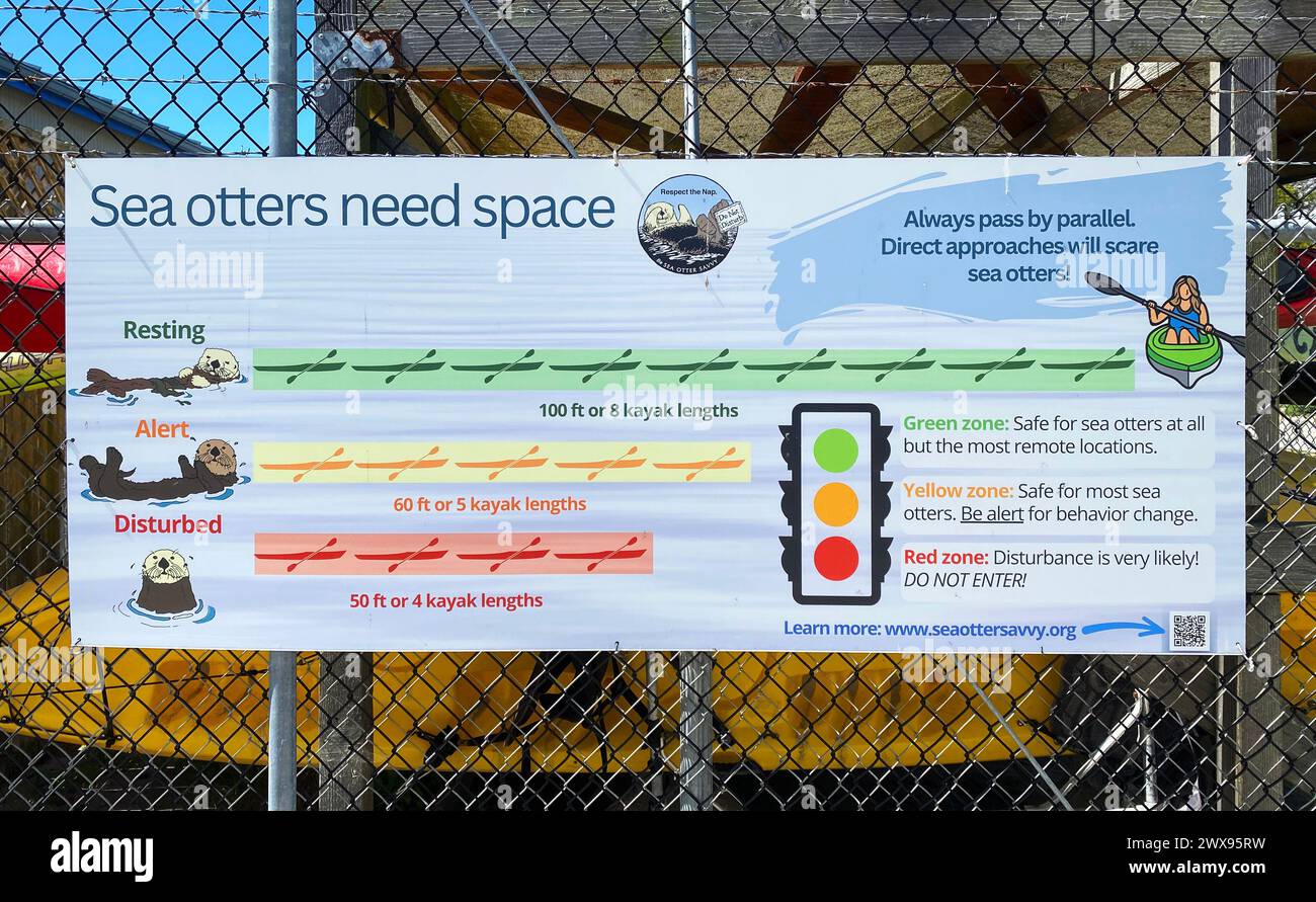 Warning sign reading "Sea otters need space," instructing boaters about ...