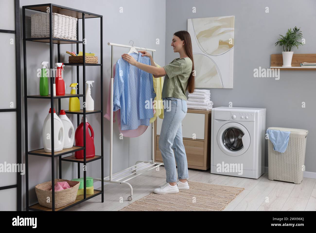Woman sorting laundry washing machine hi-res stock photography and ...