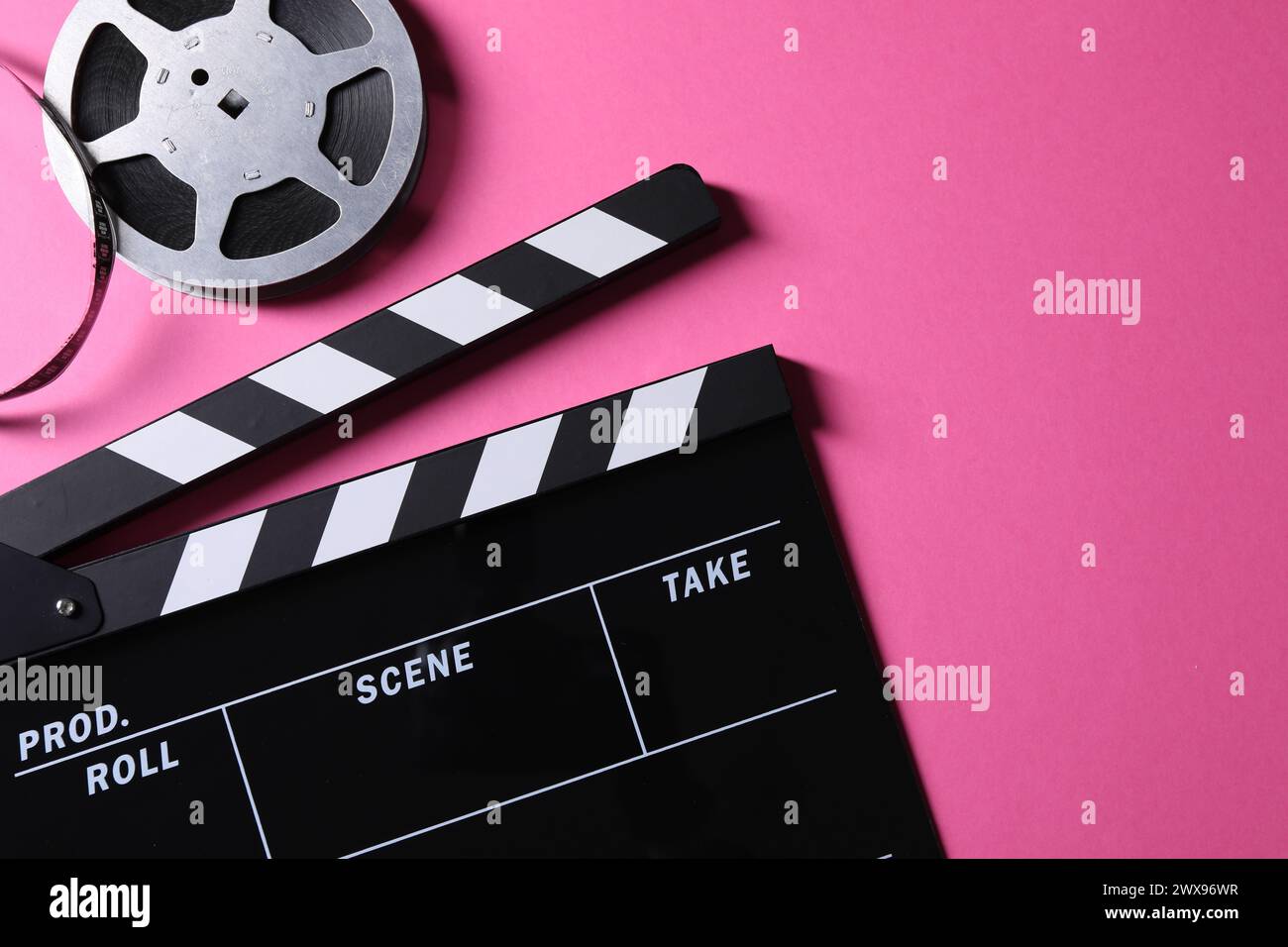 Vintage clapperboard on pink hi-res stock photography and images - Alamy