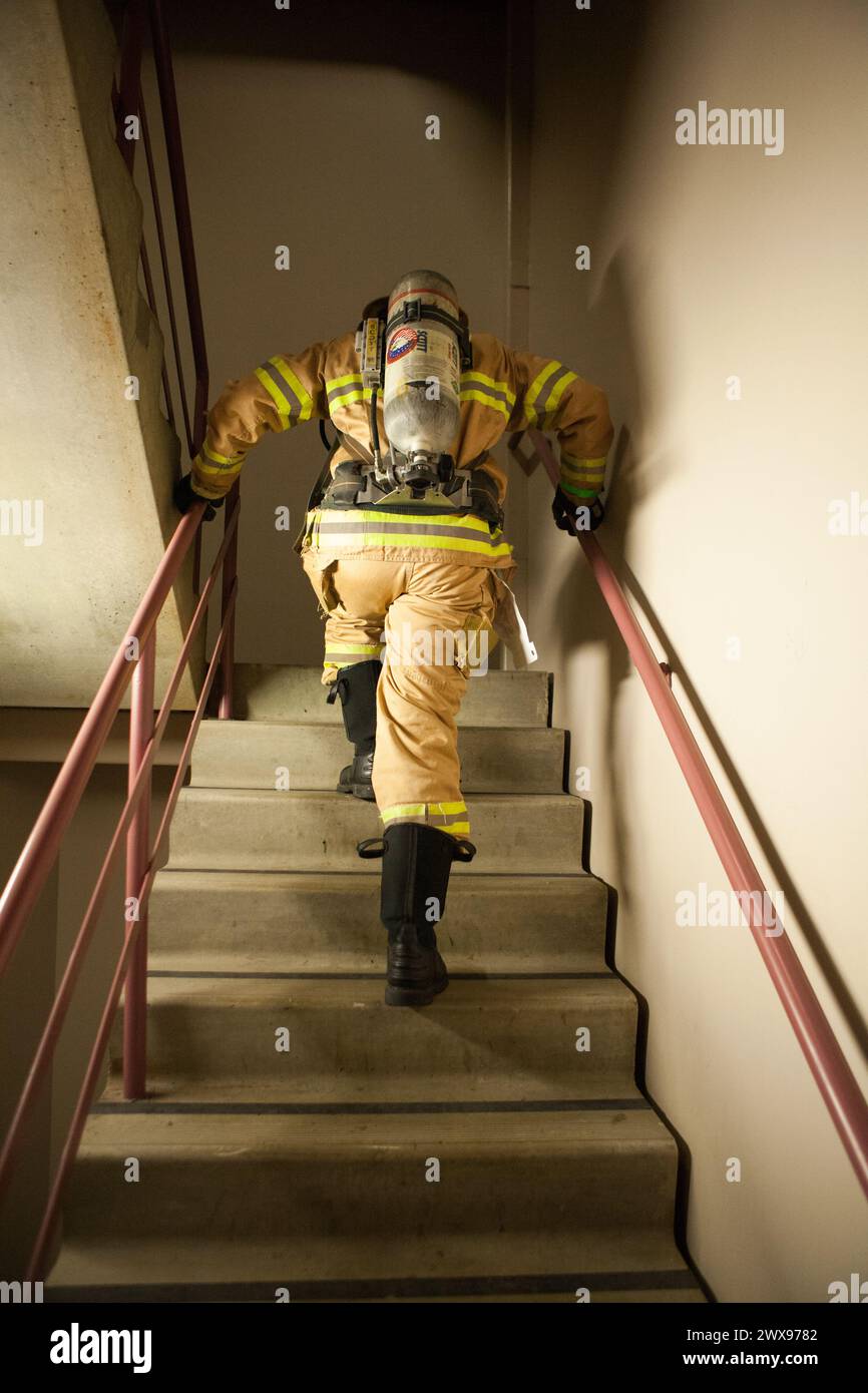 Firefighter on Stairs Stock Photo - Alamy