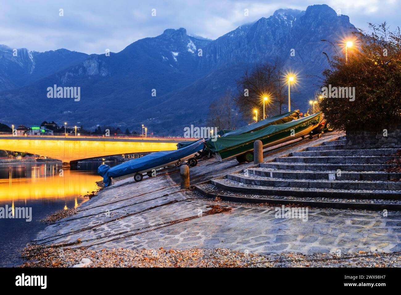 Boats docked at marina on Lake Como in the harbor of the city of Lecco ...