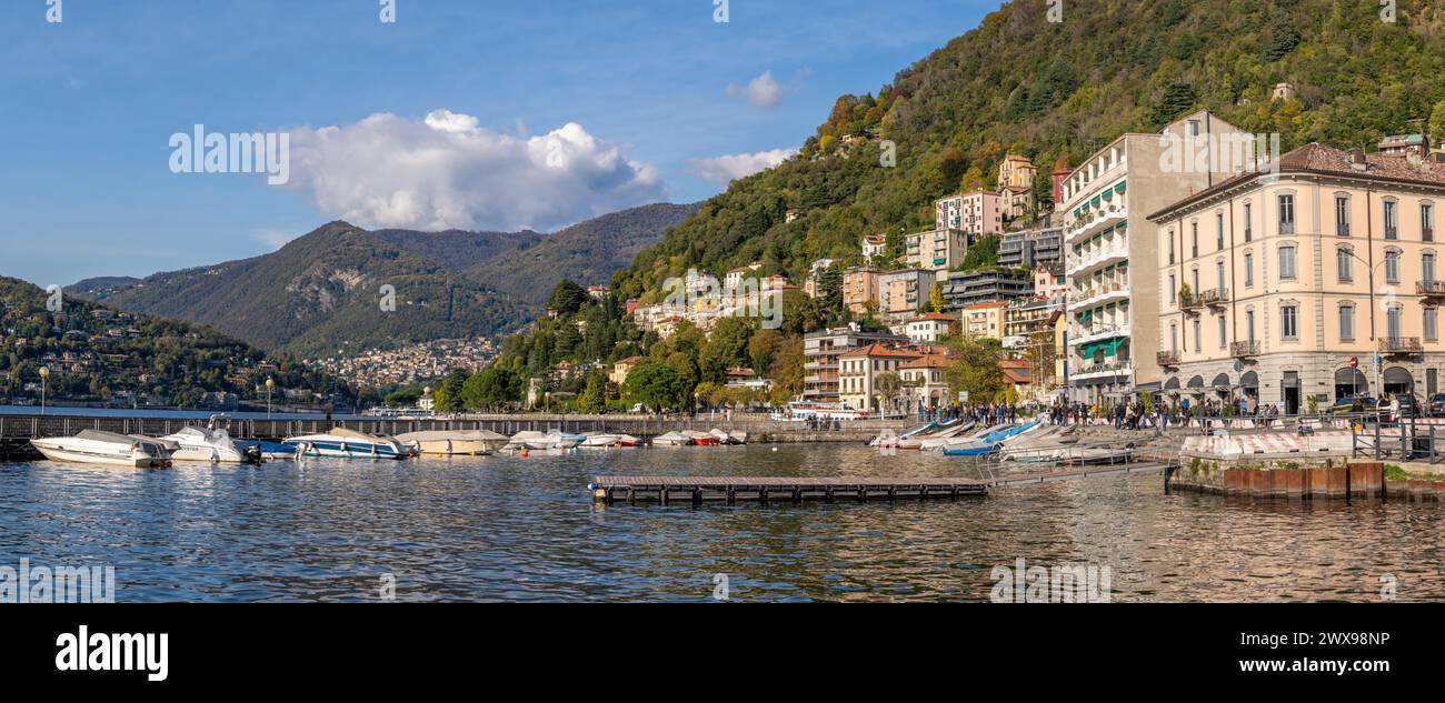 Pier and boats docked at marina on Lake Como in the harbor of the city ...