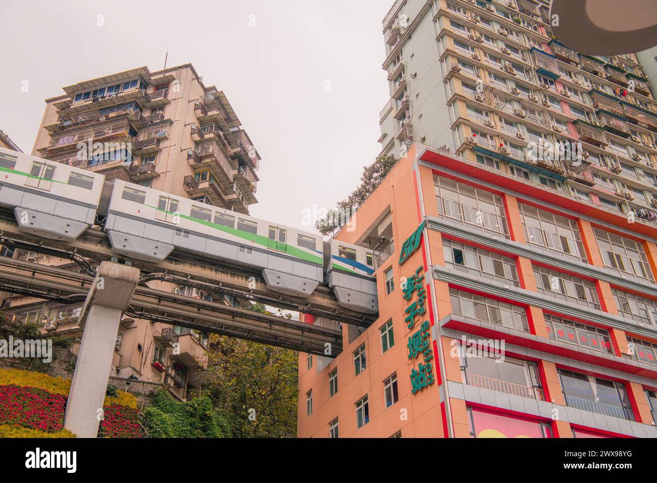 Chongqing China, 09 December 2022 : Chongqing Rail Transit Line 2 through a residential building ...