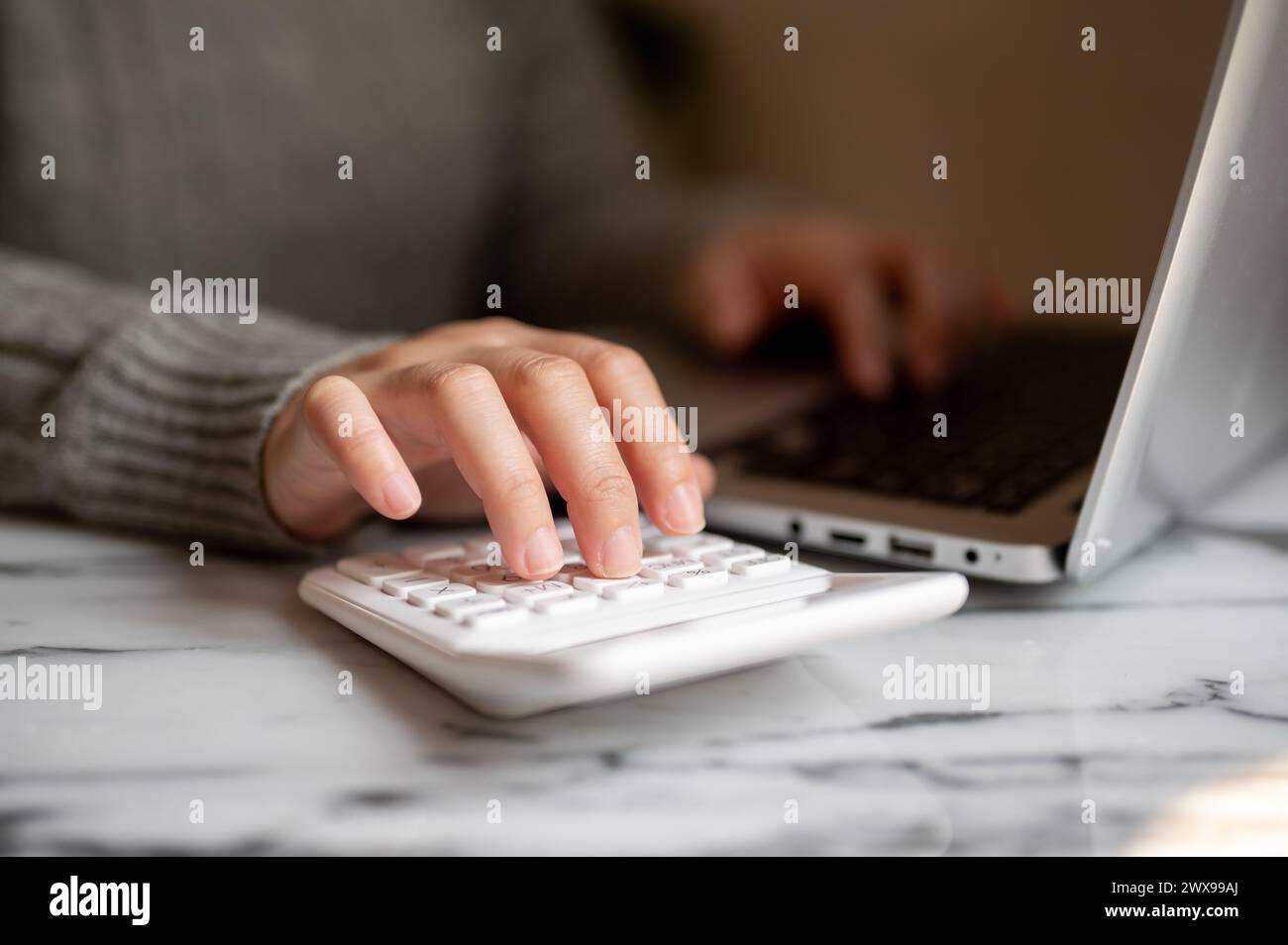 Typing on a calculator hi-res stock photography and images - Alamy