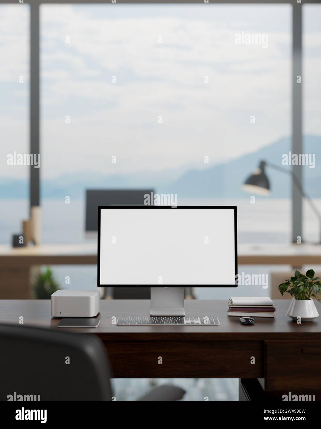 A white-screen PC computer mockup and office supplies on a desk in a ...
