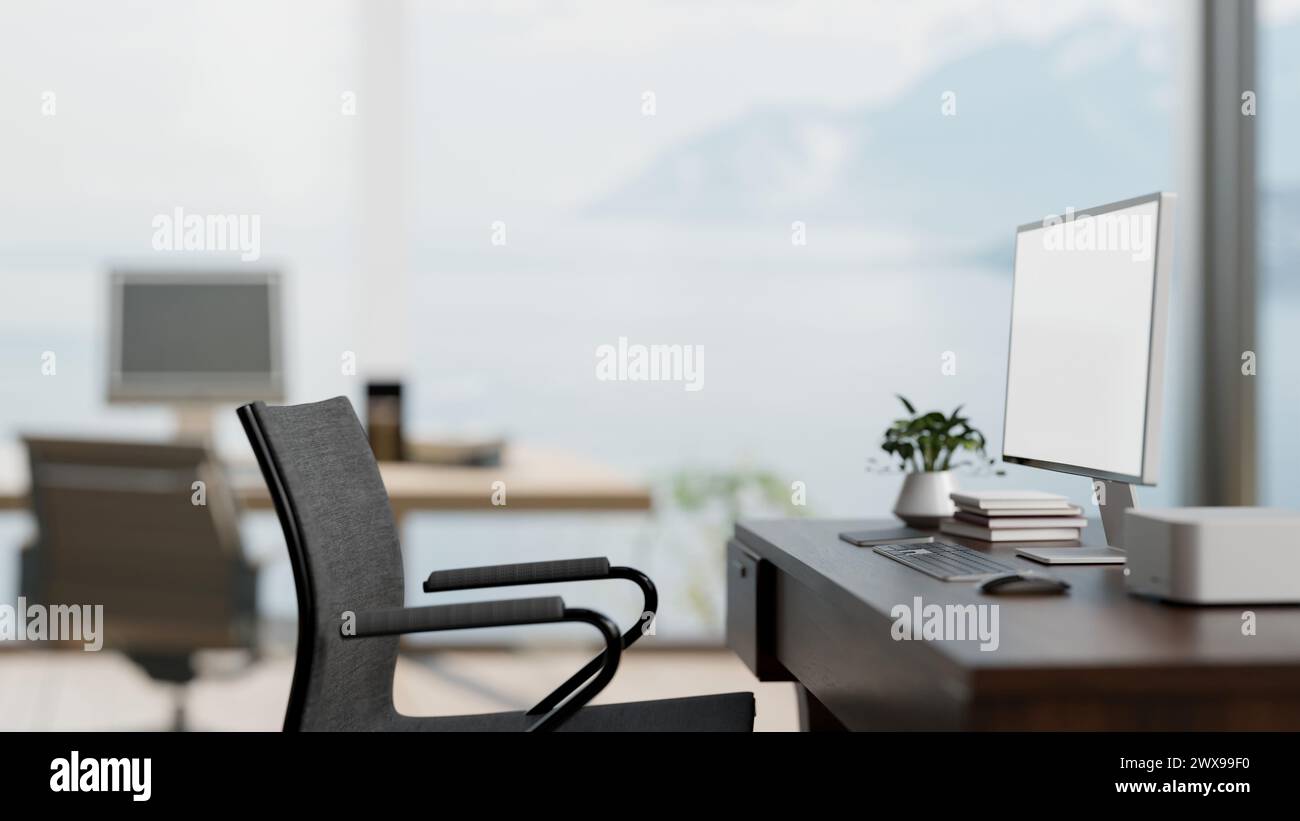 A side view image of a computer desk in a modern bright office with an ...