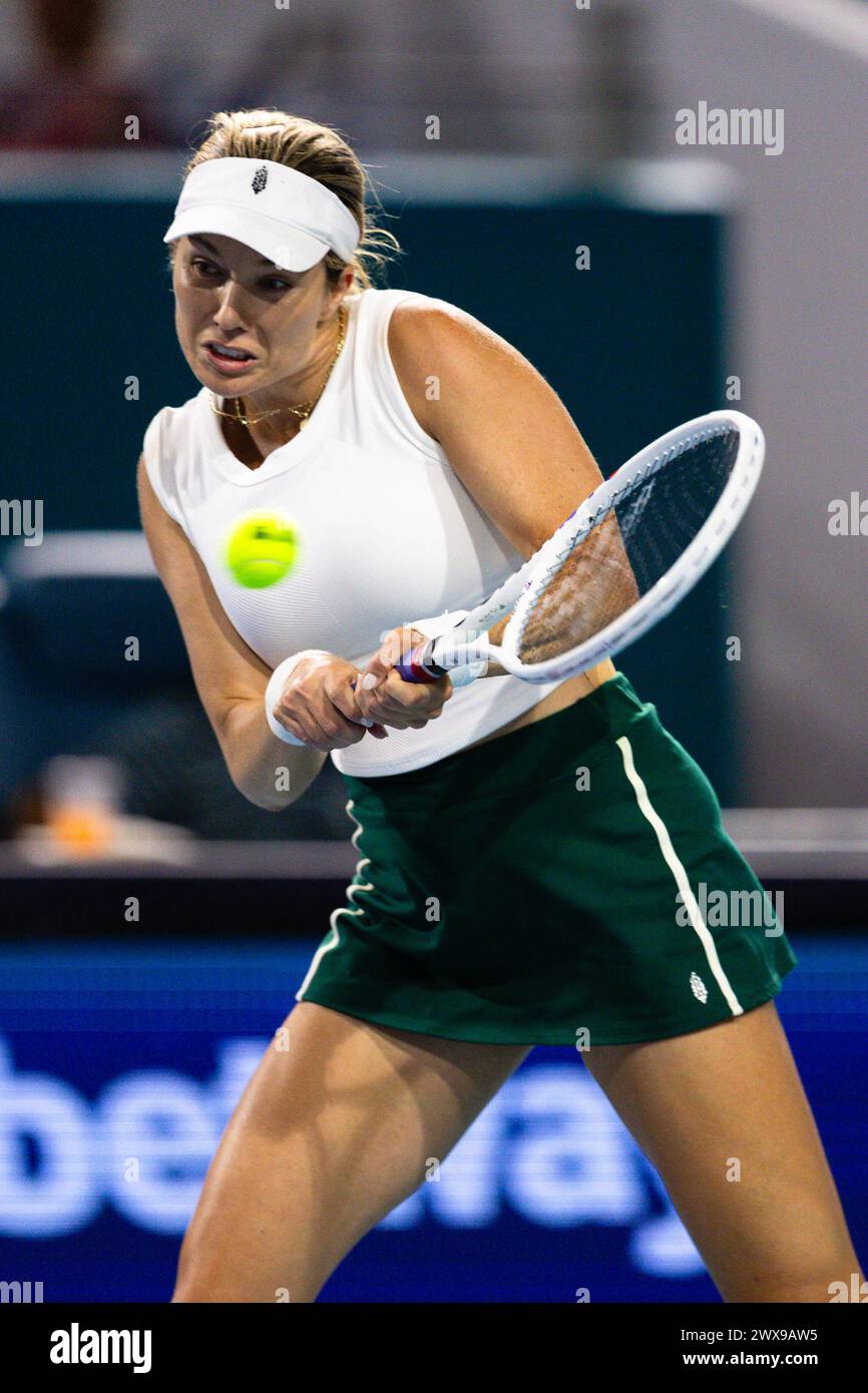 MIAMI GARDENS, FLORIDA - MARCH 28: Danielle Collins returns a shot ...