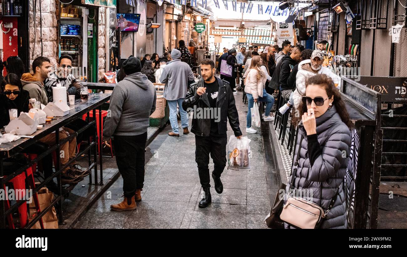 Jerusalem, Israel - December 22, 2023 People shopping at Mahane Yehuda ...