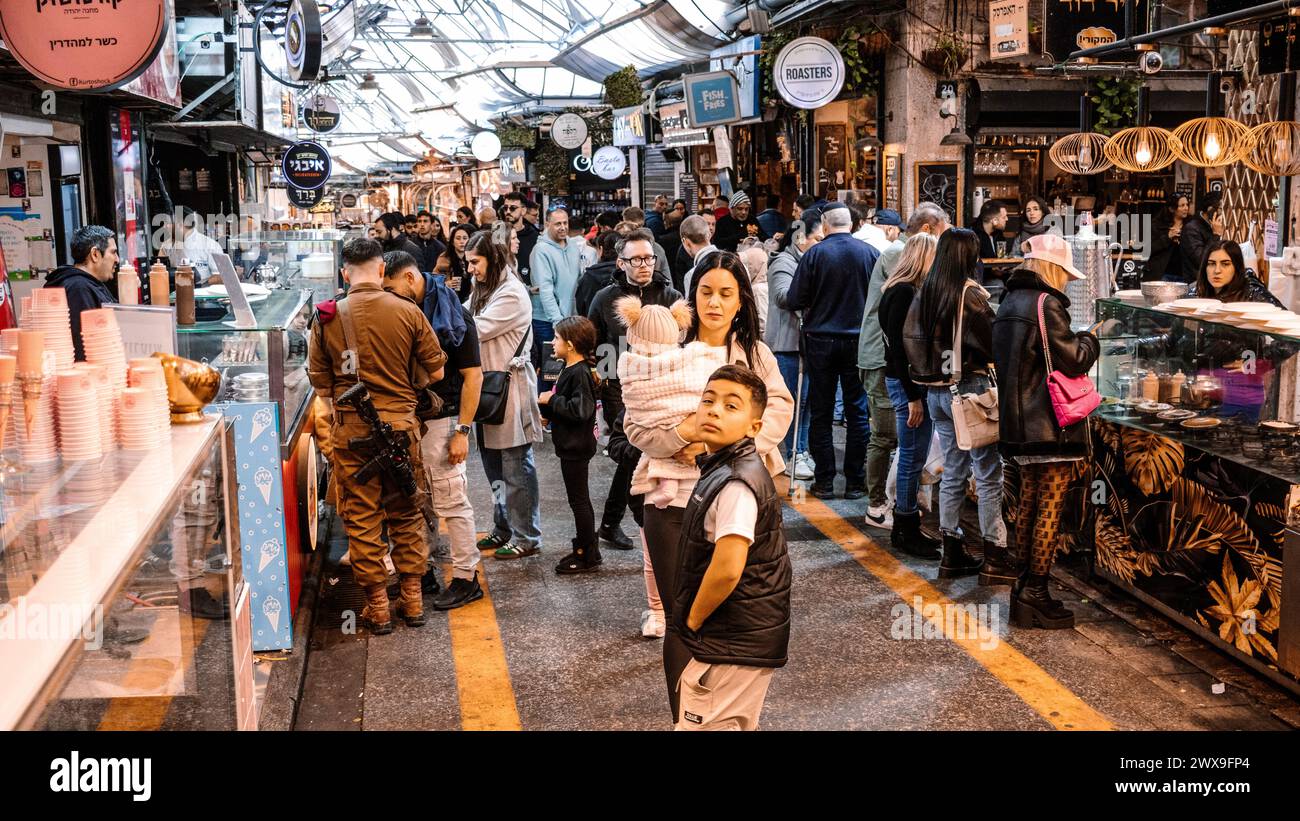 Jerusalem, Israel - December 22, 2023 People shopping at Mahane Yehuda ...