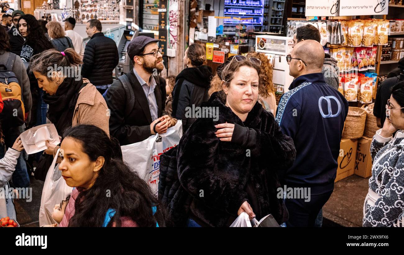Jerusalem, Israel - December 22, 2023 People shopping at Mahane Yehuda ...