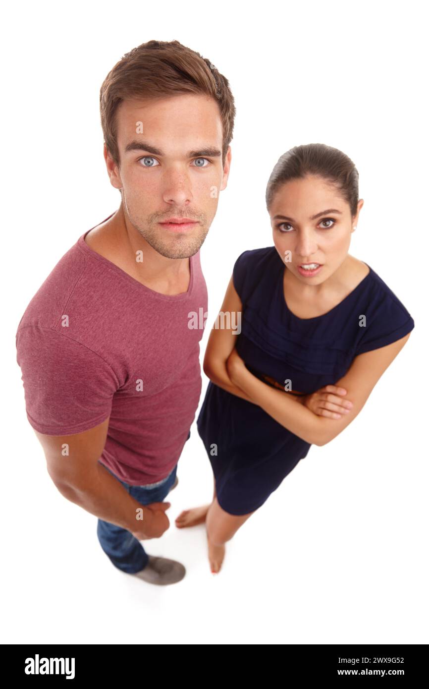Portrait, top view and annoyed couple in studio with aggressive ...