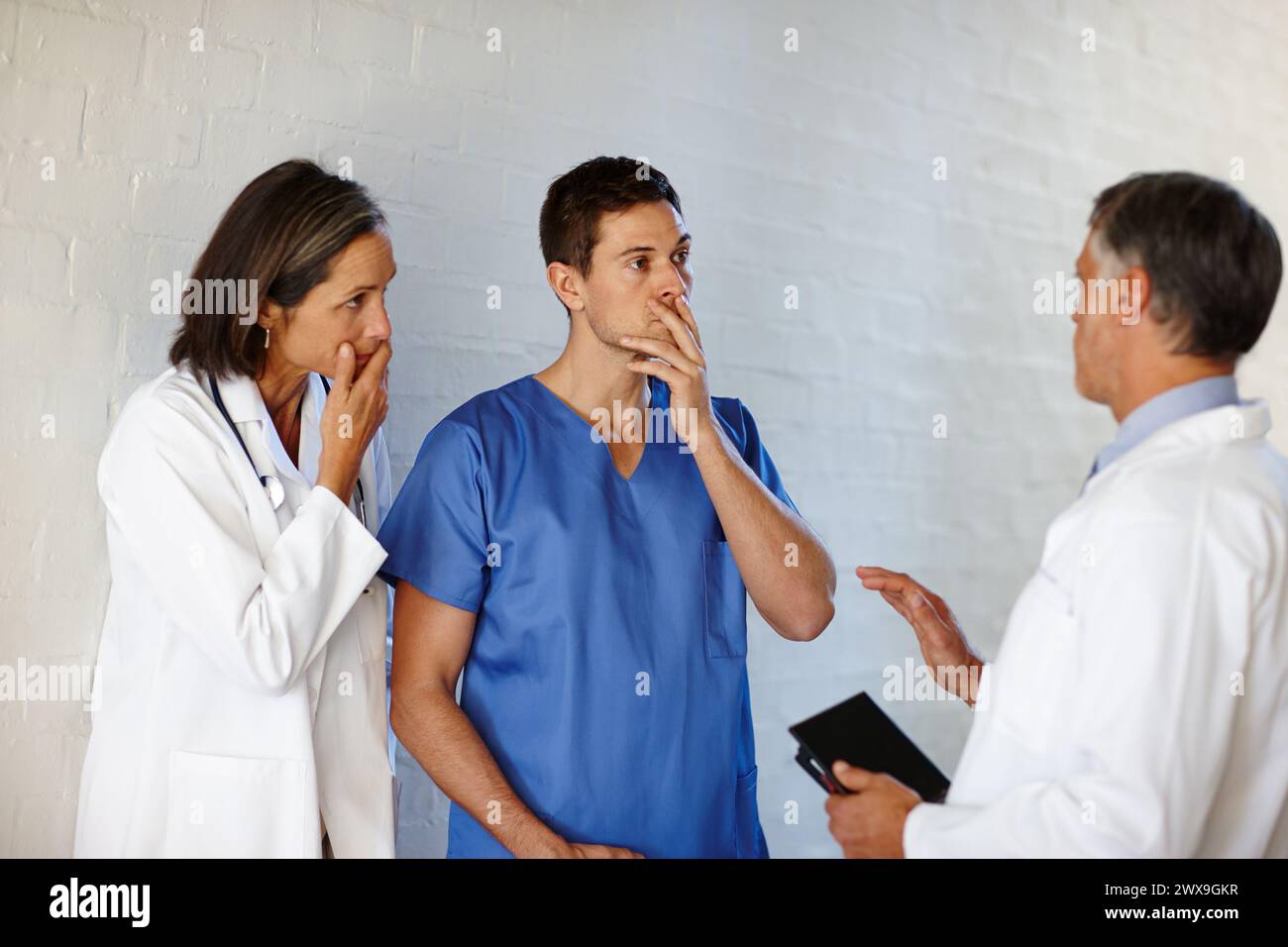 Medical, team and worried nurse with doctor in hospital, bad news or ...