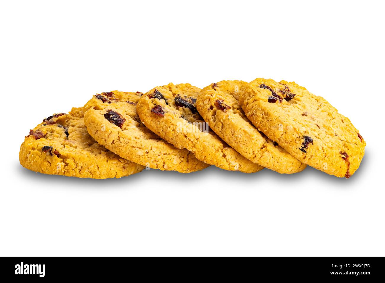 Pile of circular crispy oat flakes and cranberry biscuits isolated on ...