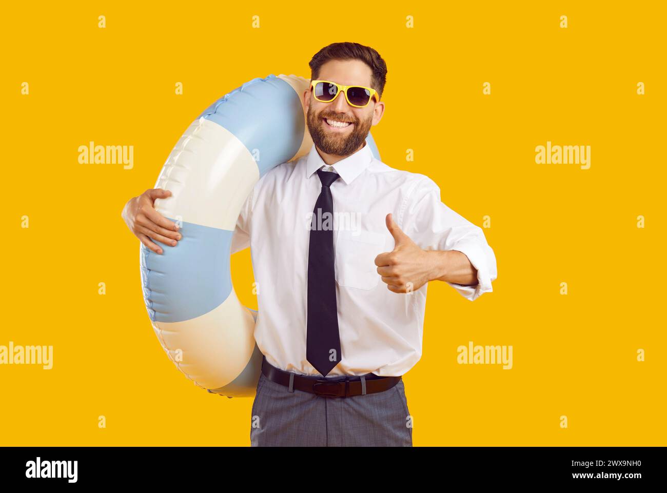 Businessman with Inflatable Ring Gives Thumbs Up on Orange Background ...
