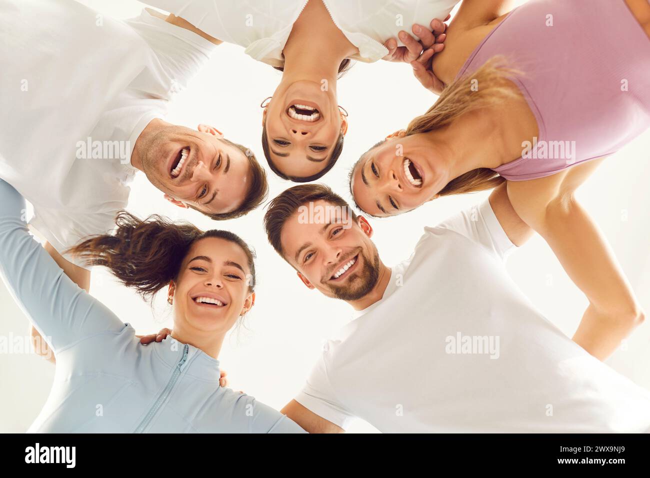 Bottom view portrait of a joyful smiling people friends students ...