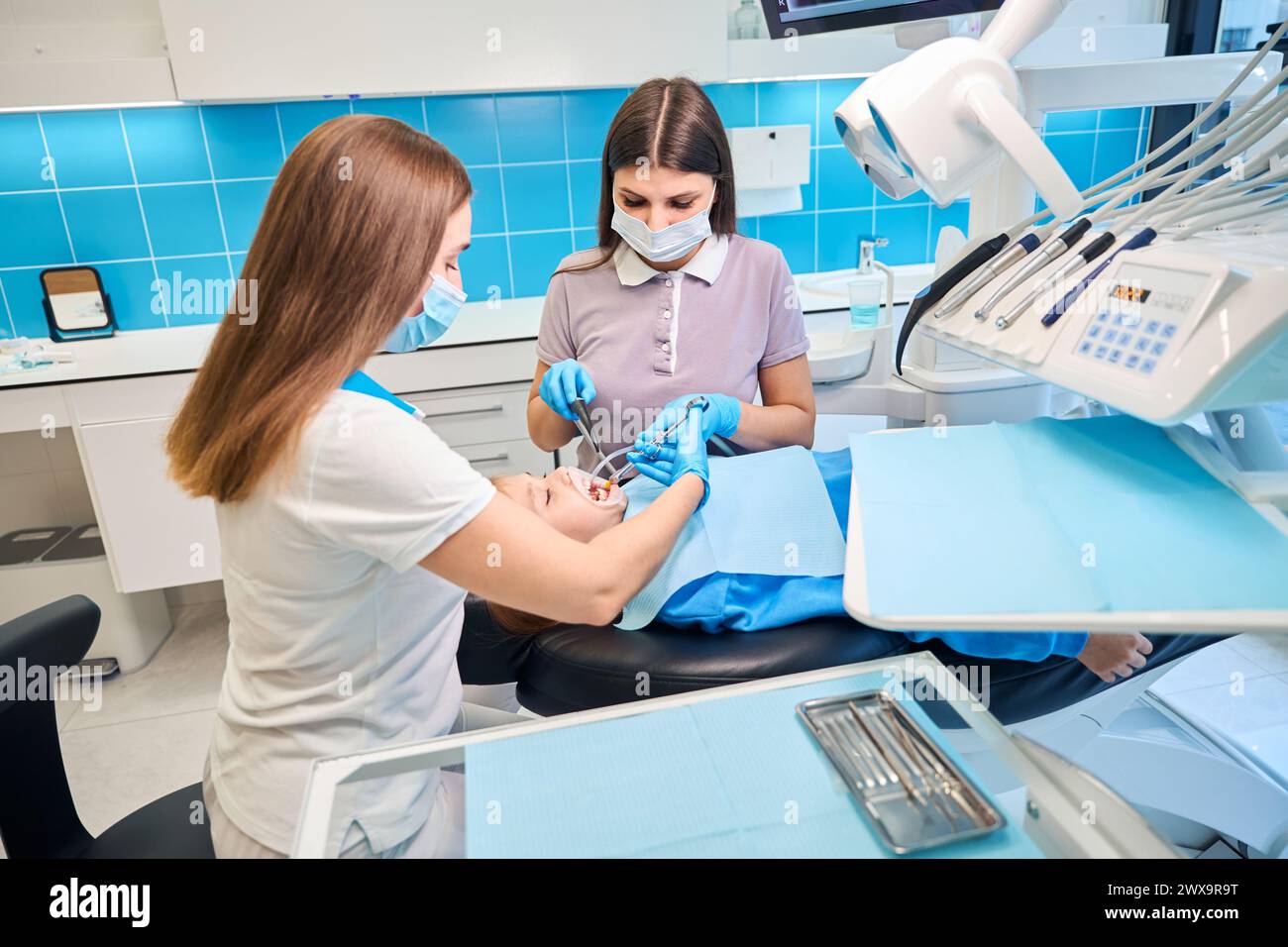 Dentist gives an injection with an anesthetic to girls gums Stock Photo ...