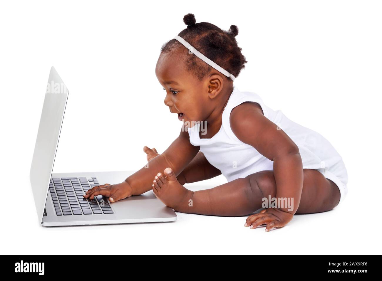African baby in studio with laptop on white background for learning ...