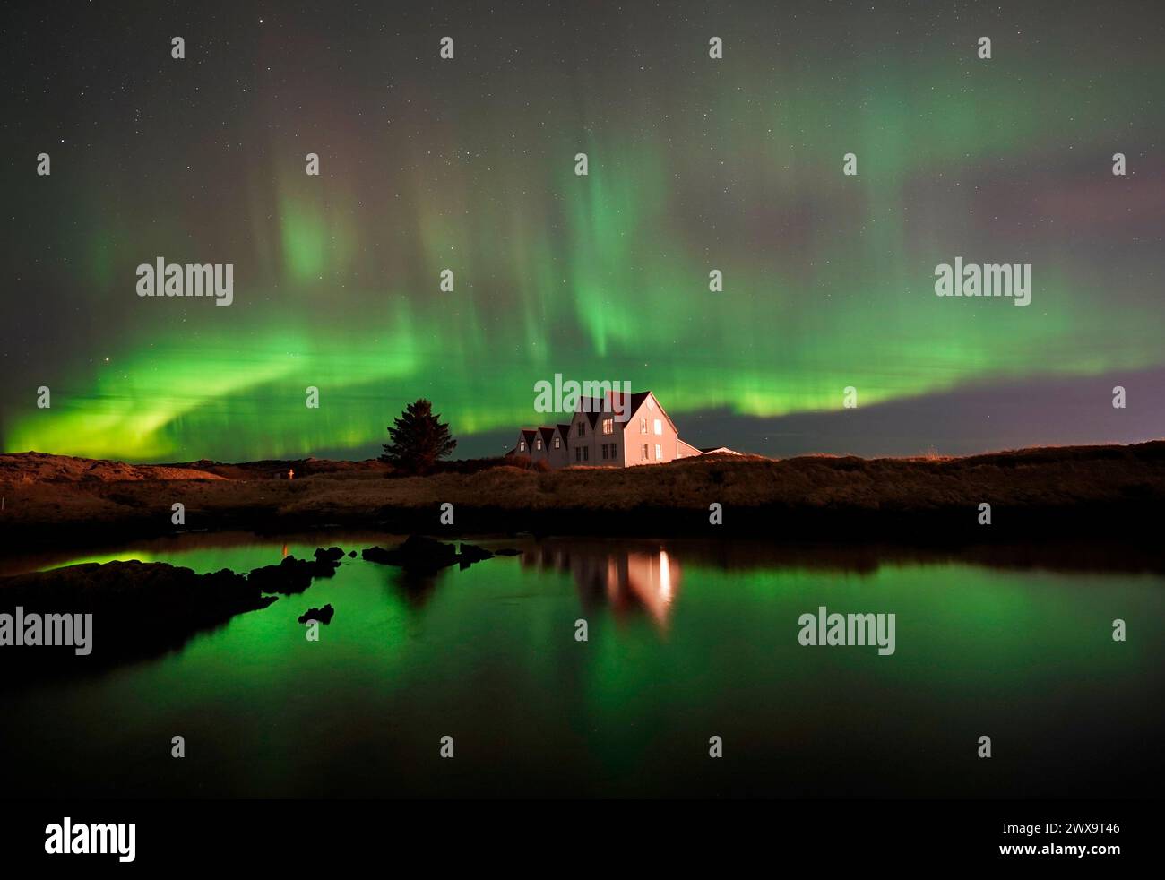 The aurora borealis, also known as the Northern Lights, fill the sky at Straumur near Keflavik ...