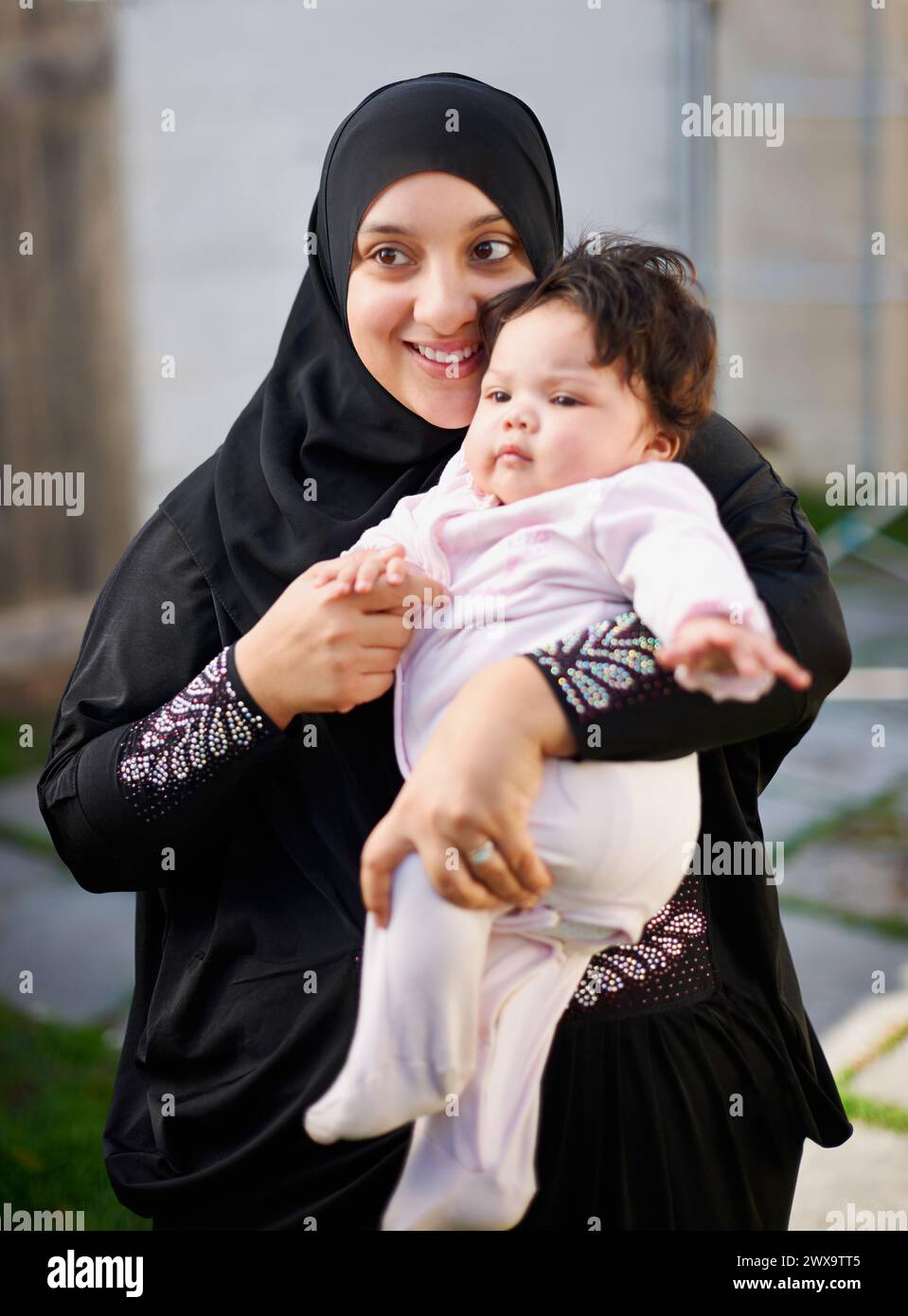 Islamic mom, girl baby and celebrate Eid in backyard of family home ...