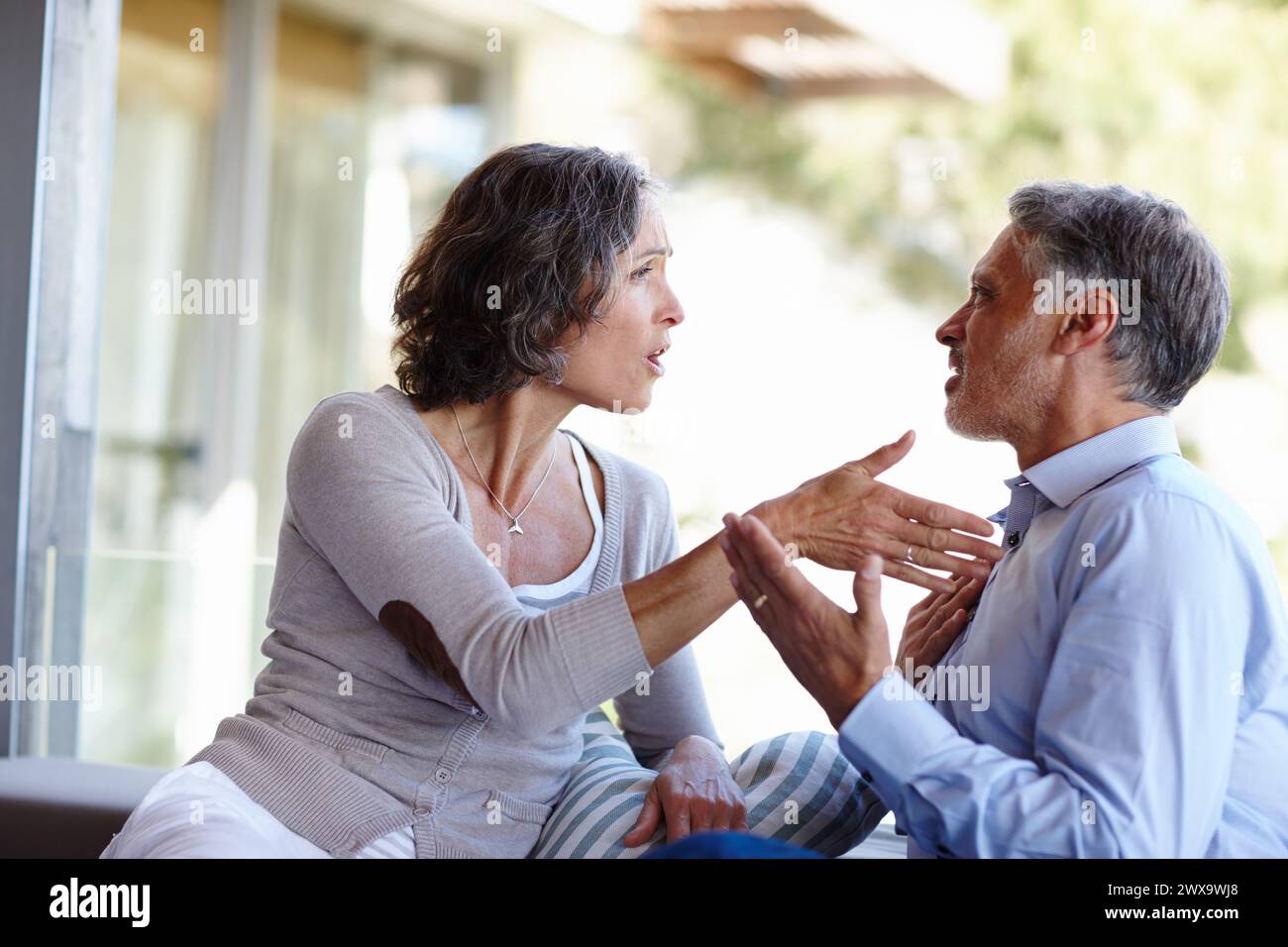 Divorce, fight and mature couple at home with anger, stress or ...