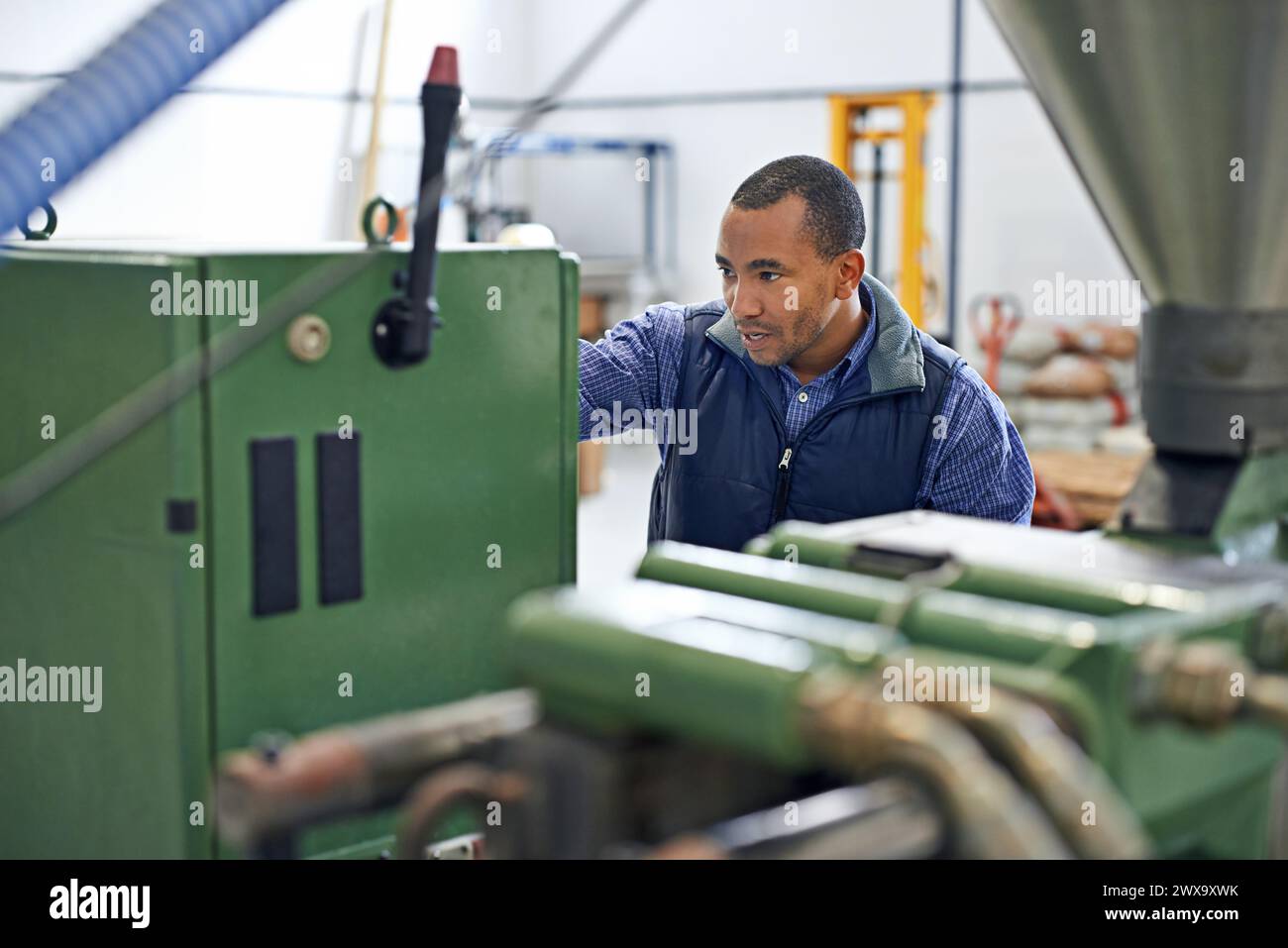 Engineer, factory and machine with warehouse, work and manufacturing ...
