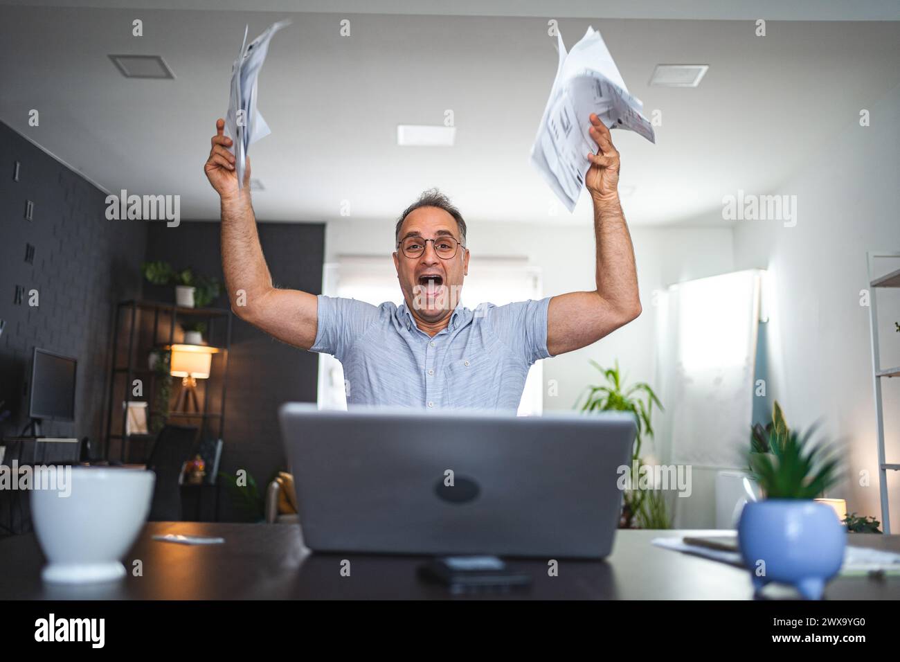 Middle aged man doing paperwork hi-res stock photography and images - Alamy
