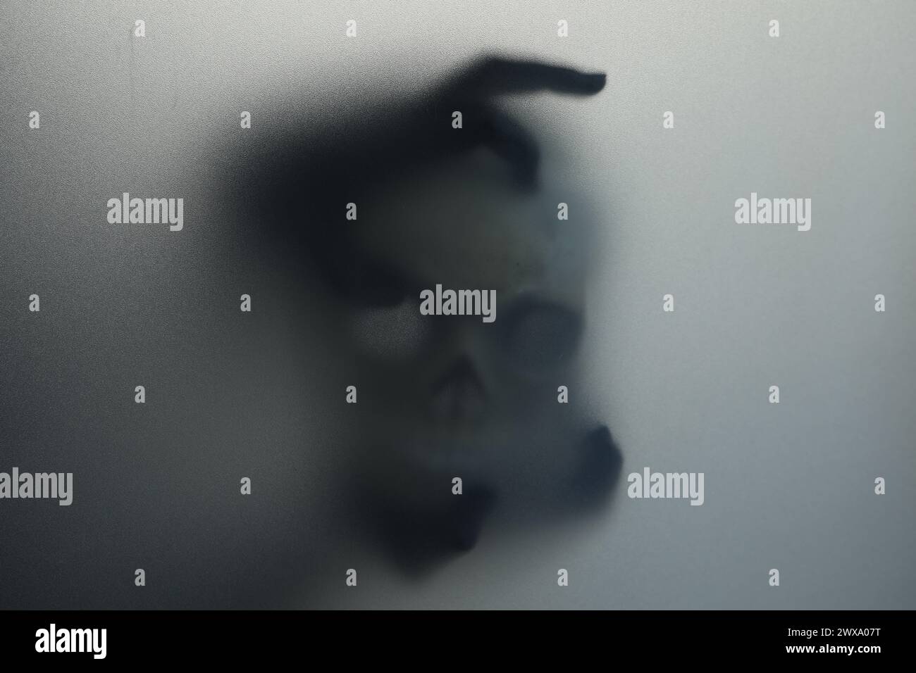 Silhouette of creepy ghost with skull behind cloth Stock Photo - Alamy