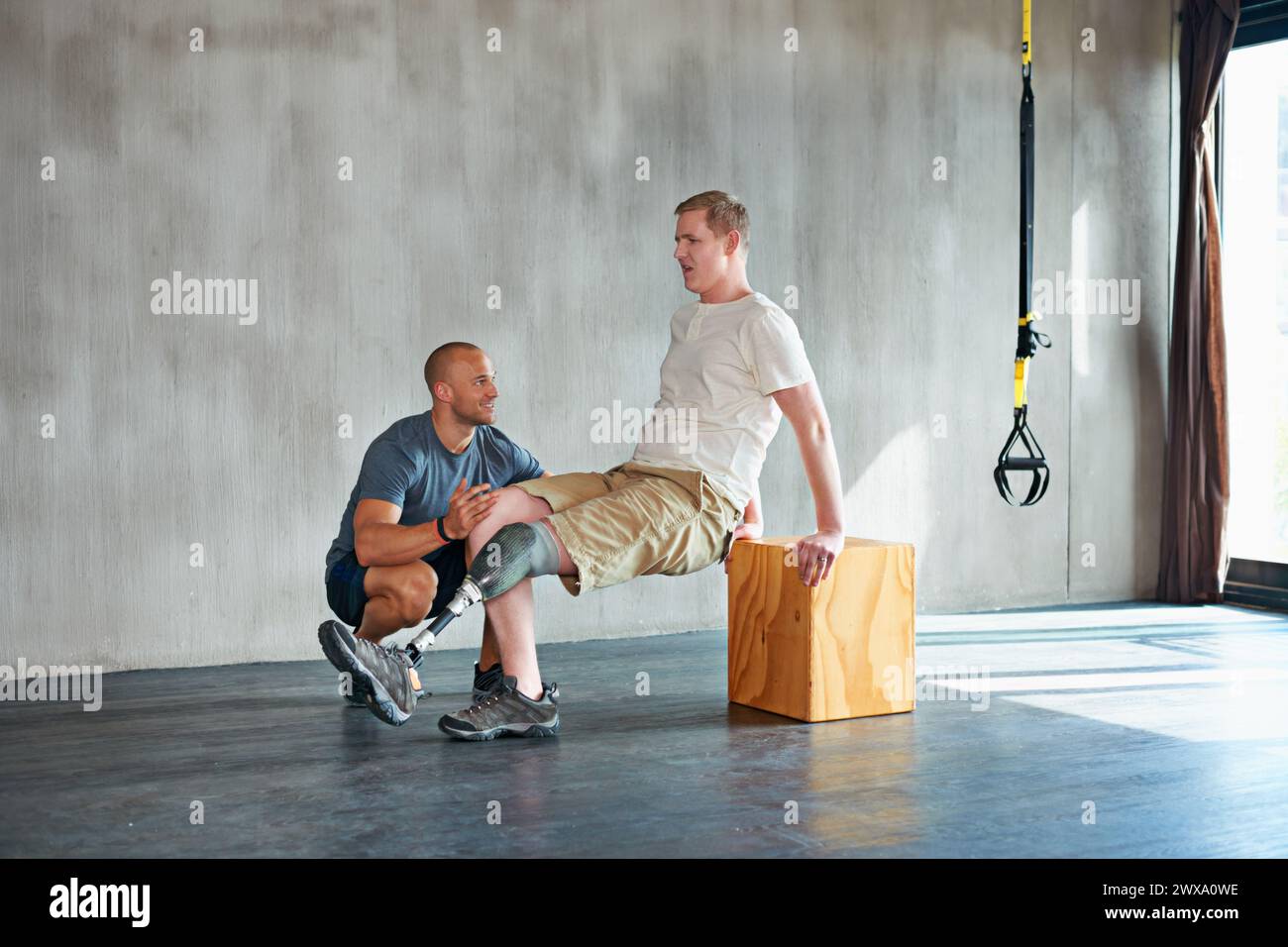 Prosthetic leg, fitness and people helping with workout, wellness and ...