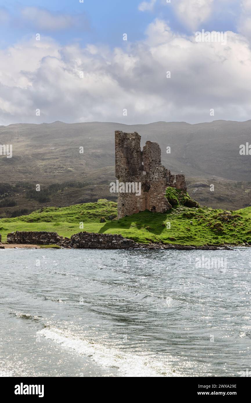 Ardvreck Castle ruins standing proudly beside a sparkling lake, under ...