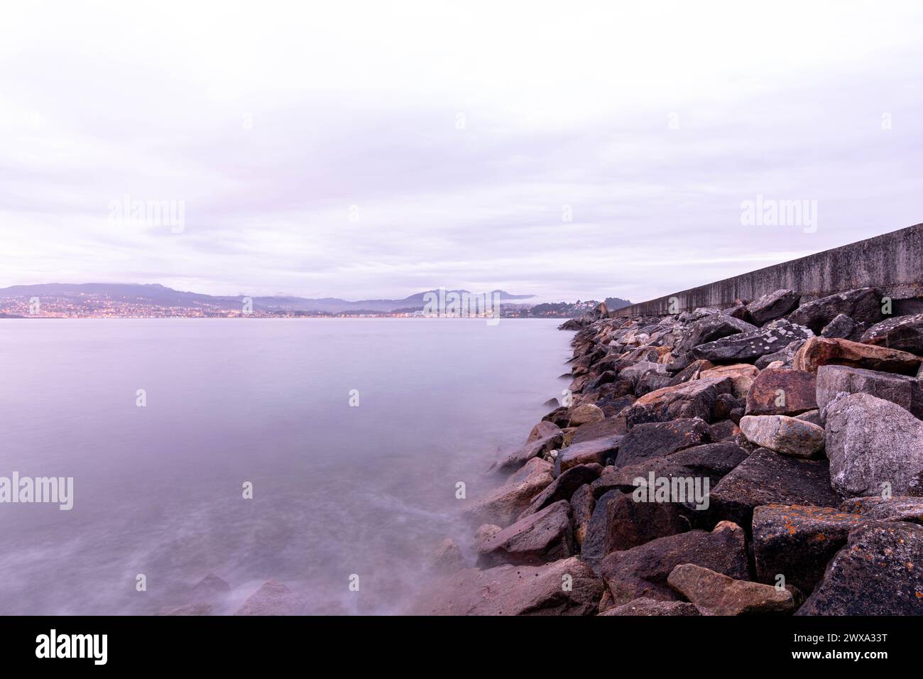 Gray coastal fortification with rough concrete blocks Stock Photo - Alamy
