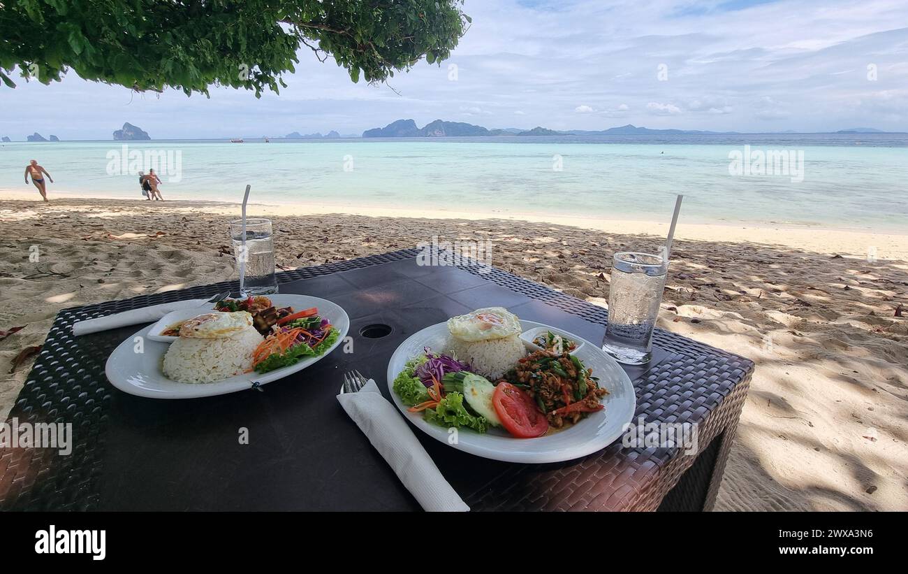 Two plates with delicious food beautifully arranged, sitting on top of ...