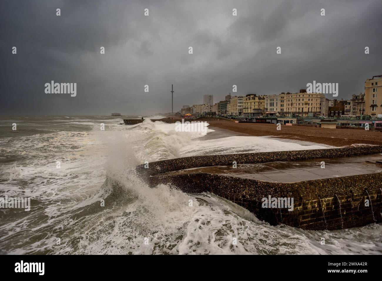Brighton, March 28th 2024: Waves batter the beach at high tide in ...