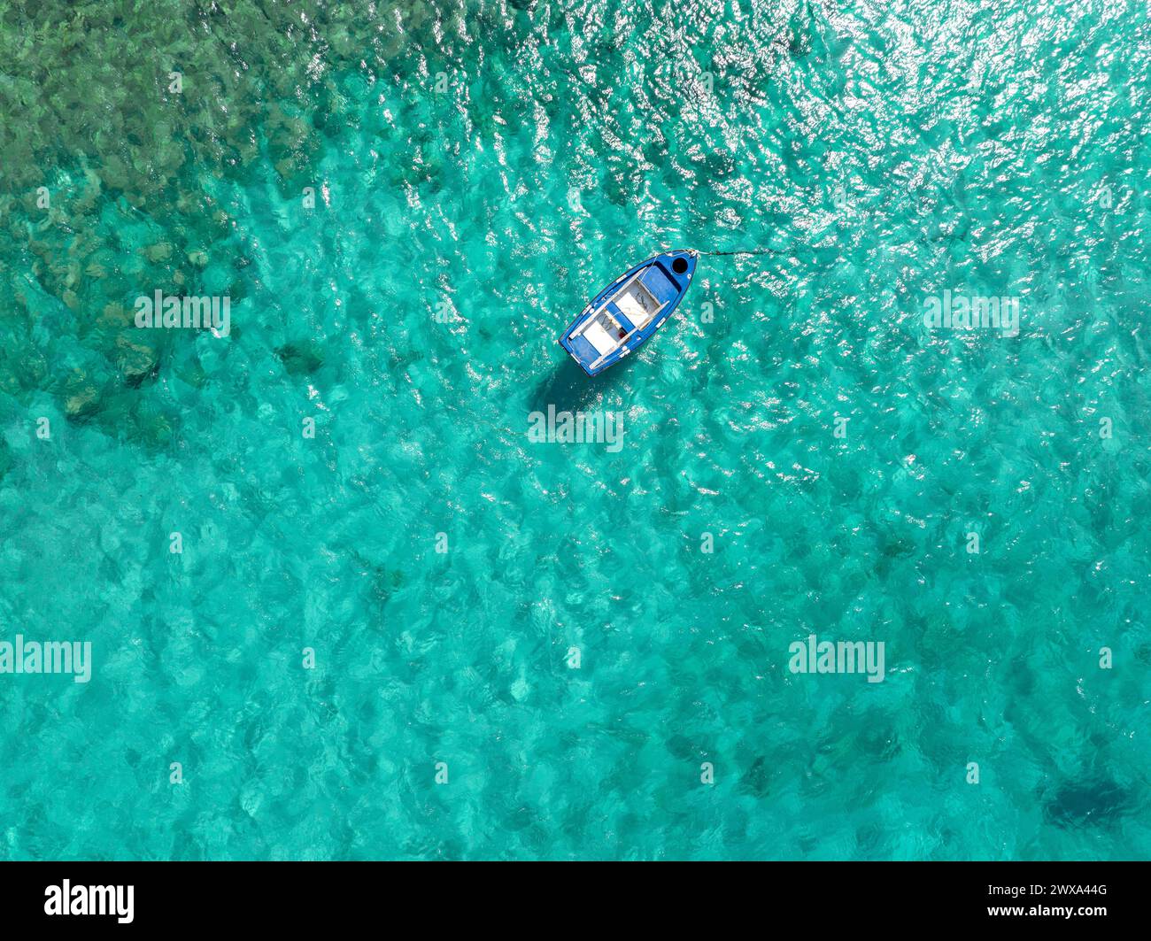 A traditional fishing boat floats in the Mediterranean Sea, Greece ...