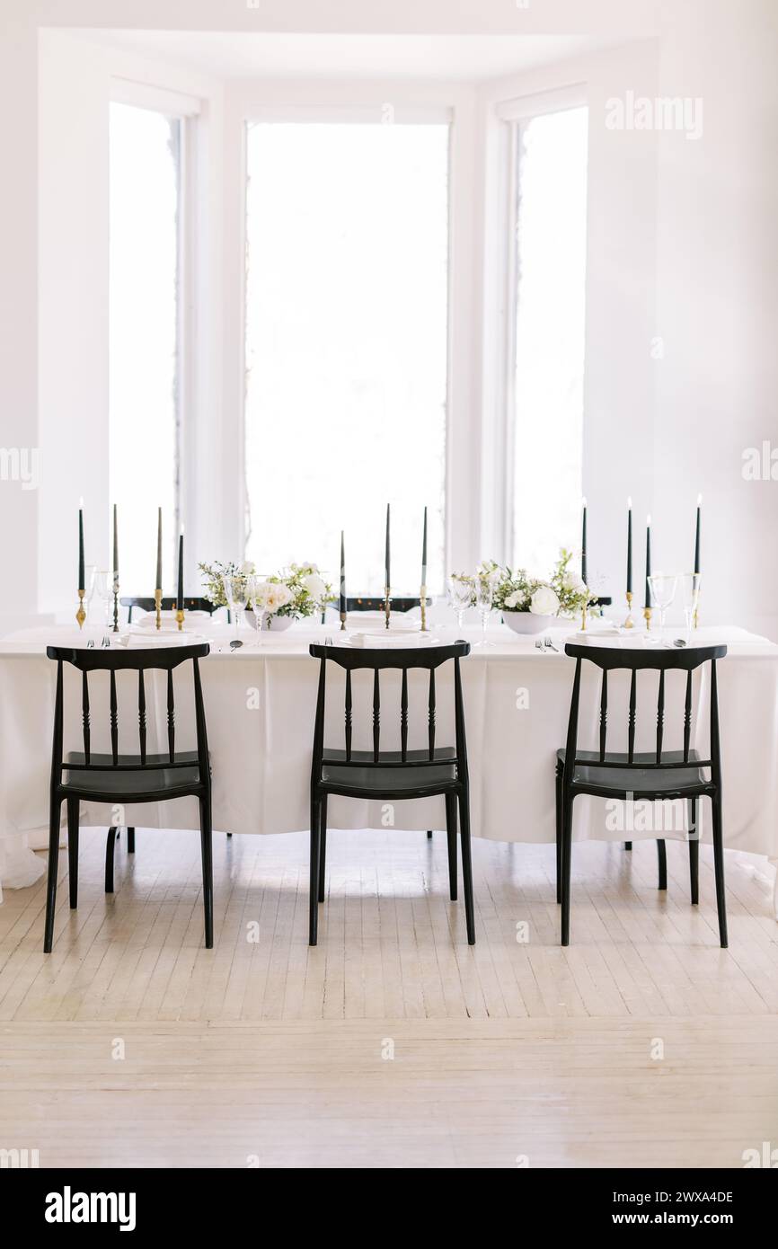 Serene wedding reception table with elegant black chairs Stock Photo ...