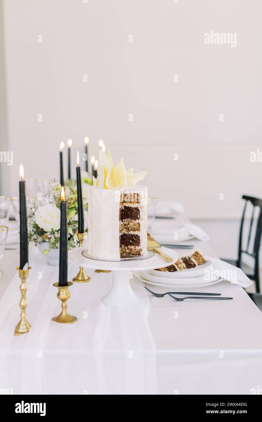 Elegant wedding cake on display with chic table setting Stock Photo - Alamy