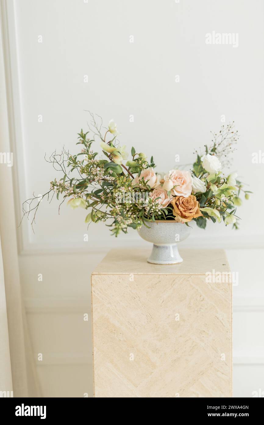 Stylish floral display on a chic pedestal Stock Photo - Alamy