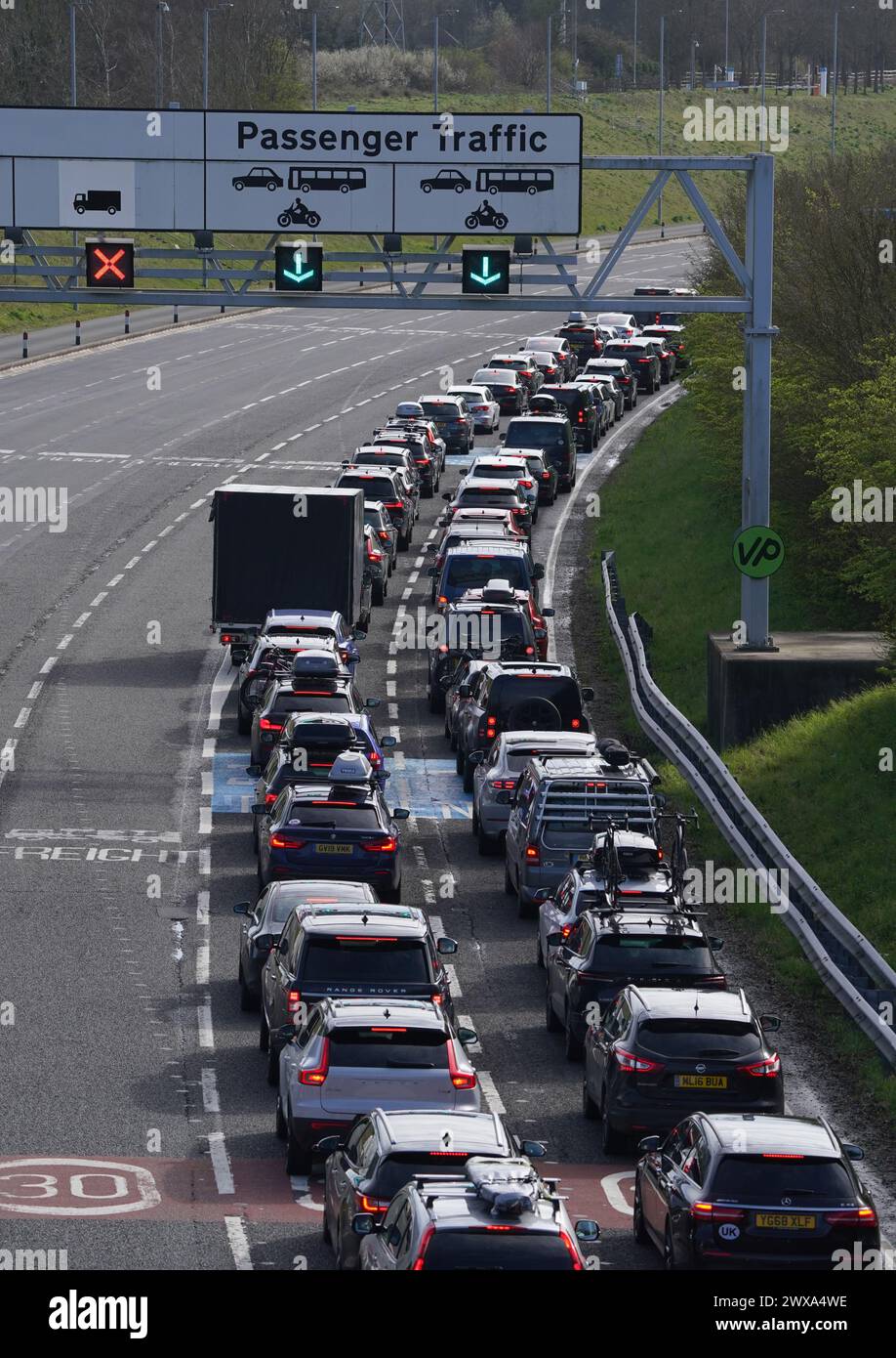 Passengers queue to enter the Eurotunnel site in Folkestone in Kent as ...