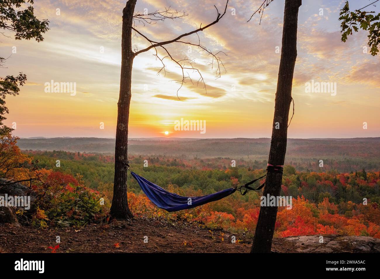 Camping during sunrise in the fall Stock Photo - Alamy