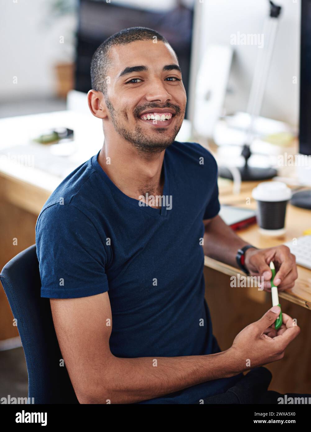 Web designer, employee and portrait of confident man at desk in ...