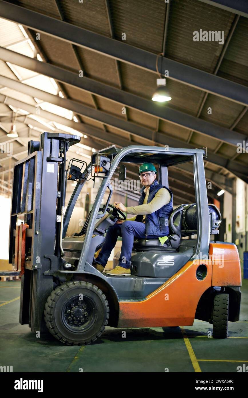 Man, forklift and driving in warehouse for site inspection, management ...