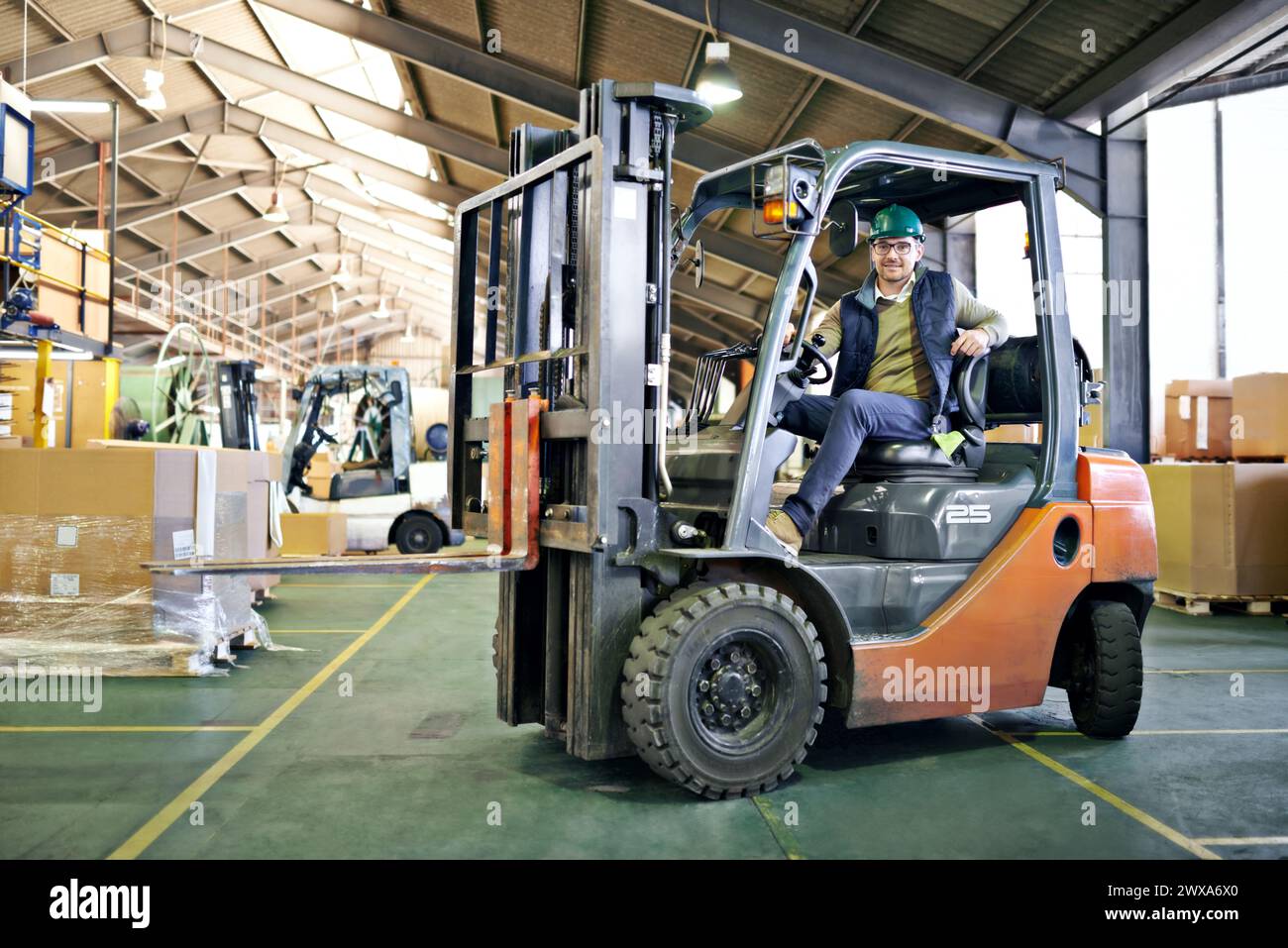 Driver, warehouse and man with forklift on site working, loading on ...
