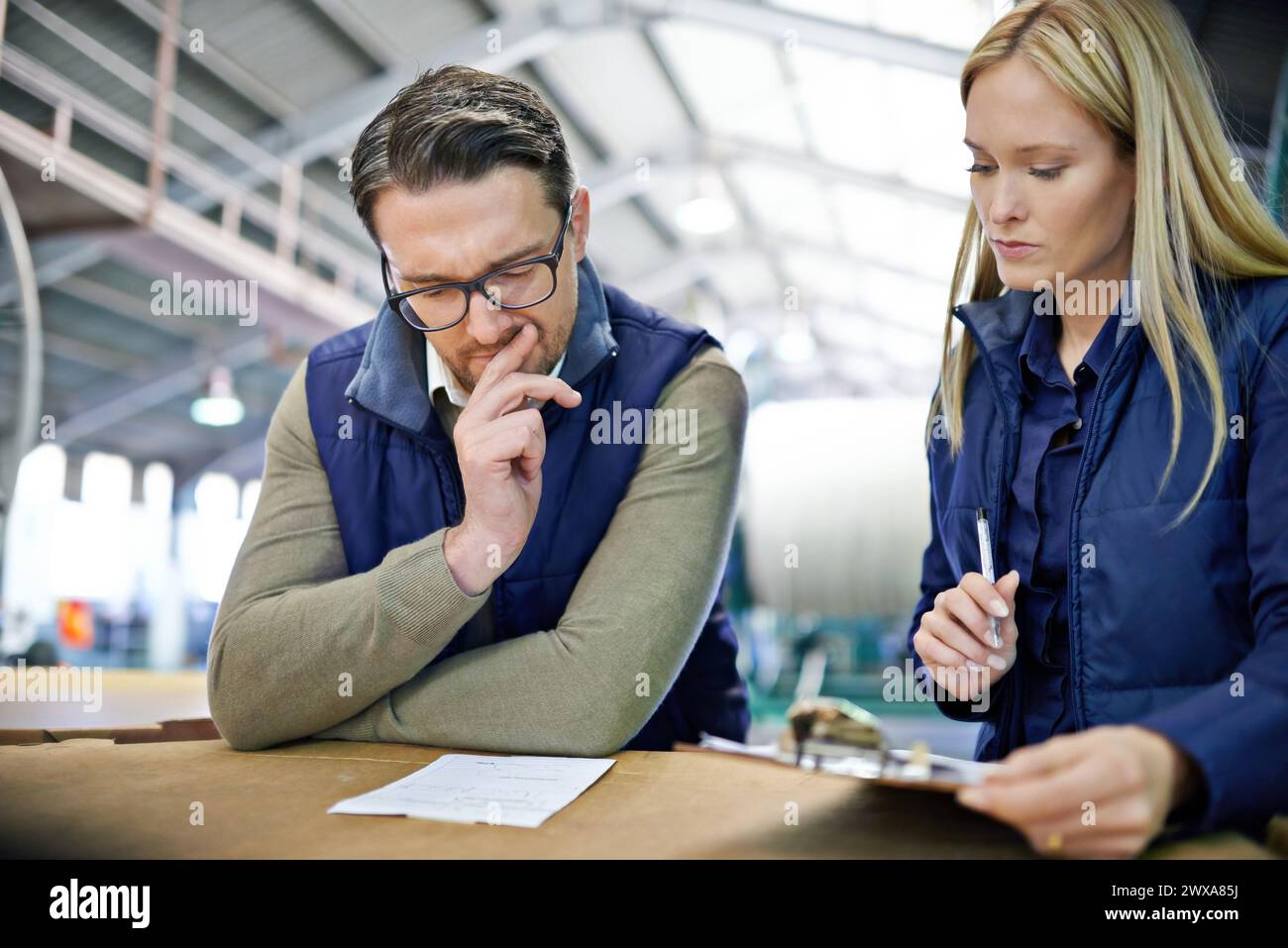 Warehouse, teamwork and people with document for shipping schedule ...