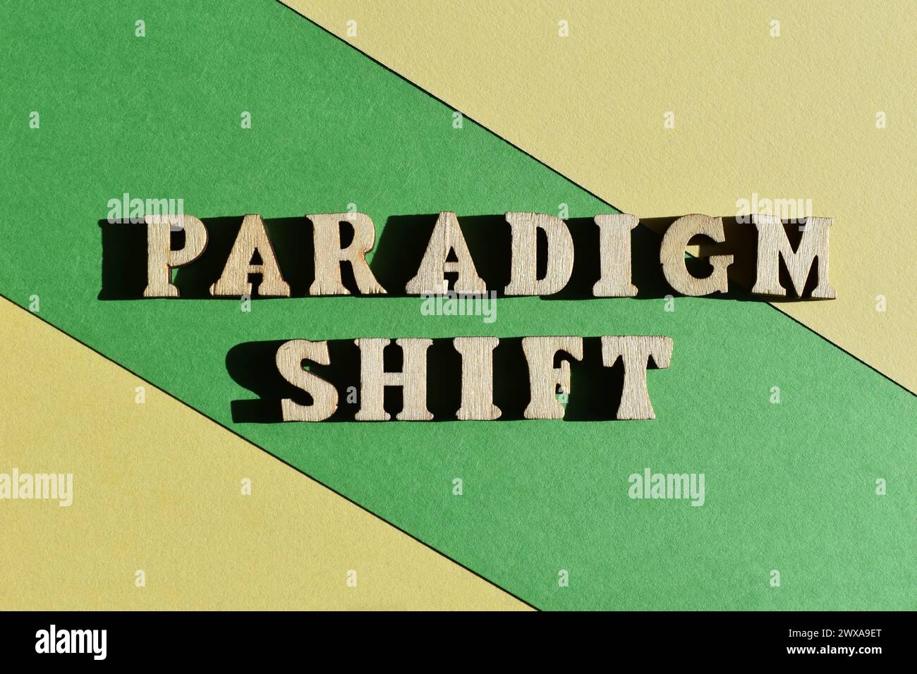 Paradigm Shift, words in wooden alphabet letters isolated on green and ...