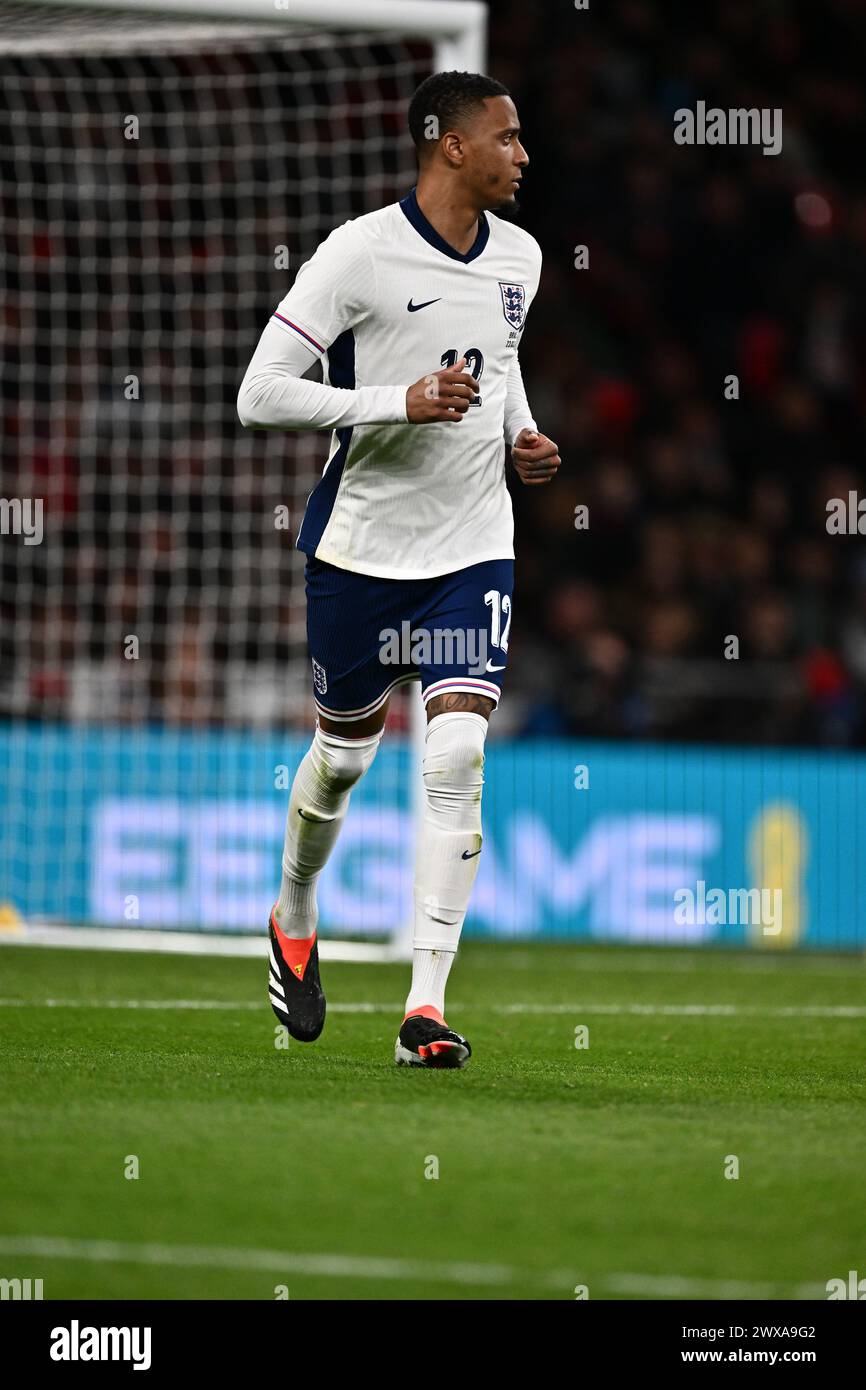 LONDON, ENGLAND - MARCH 23: Ezri Konsa of England in home kit, full ...