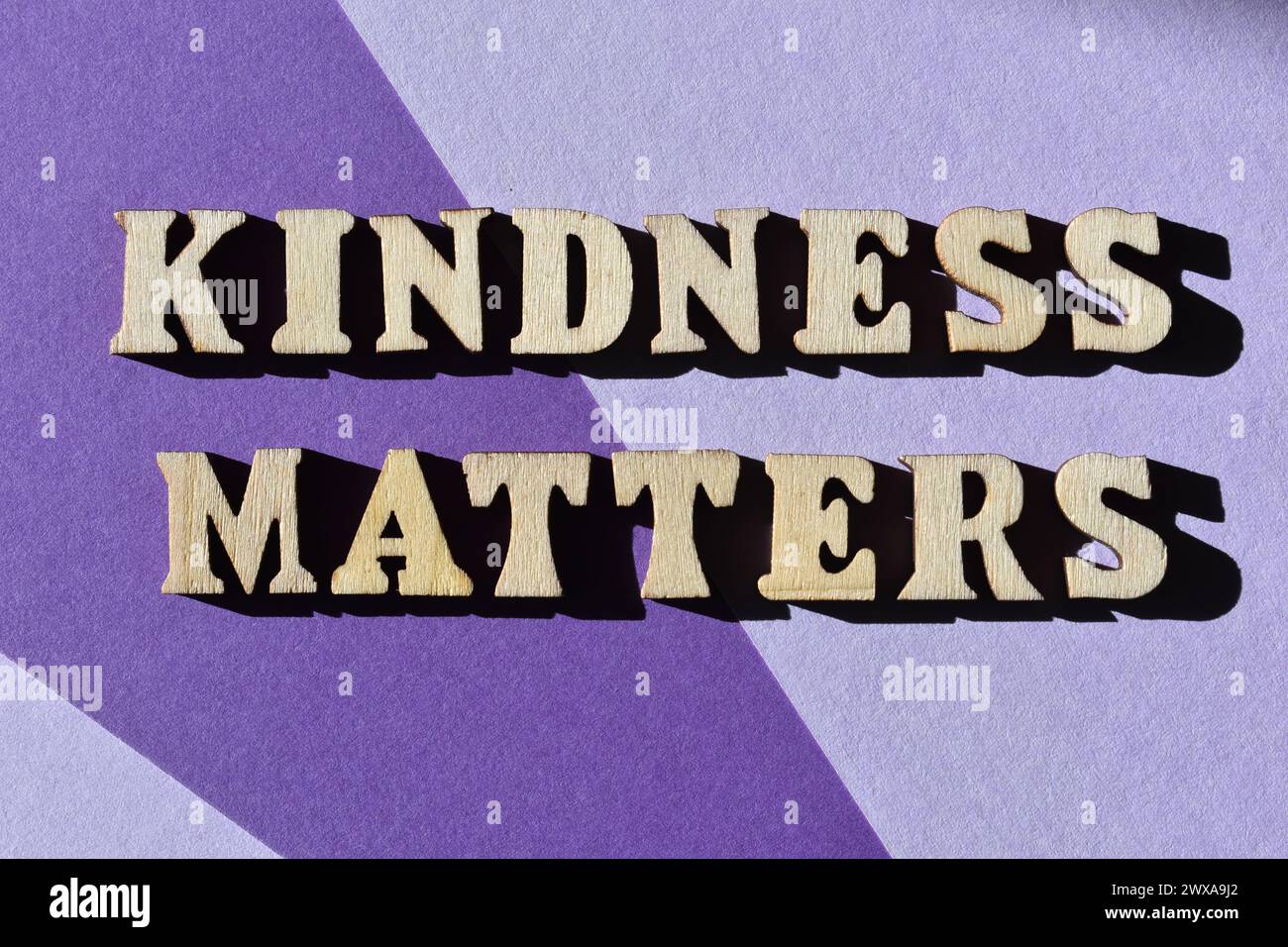 Kindness Matters, words in wooden alphabet letters isolated on purple ...