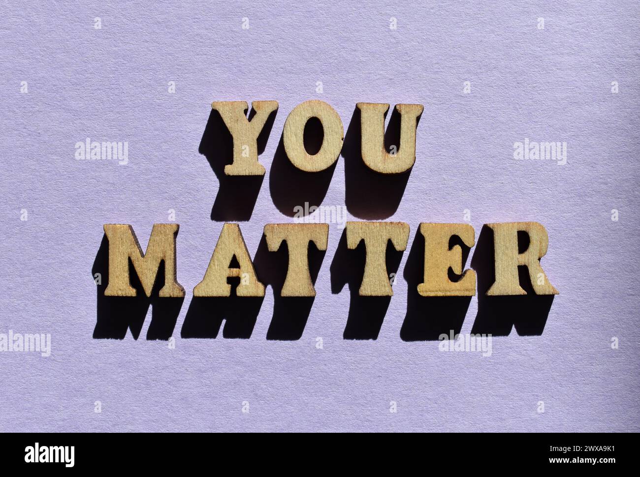 You Matter, words in wooden alphabet letters isolated on purple ...