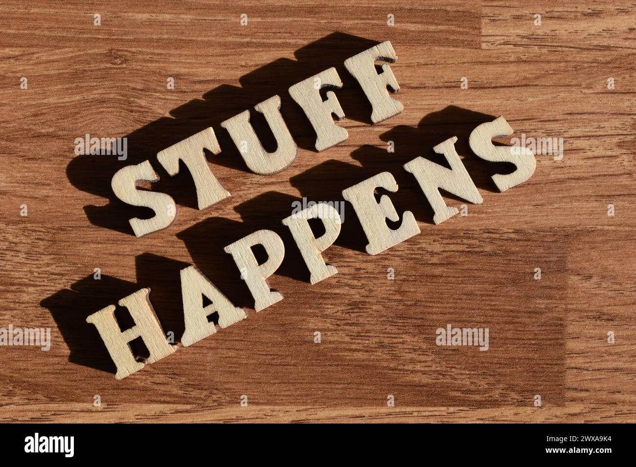 Stuff Happens, words in wooden alphabet letters isolated on background ...