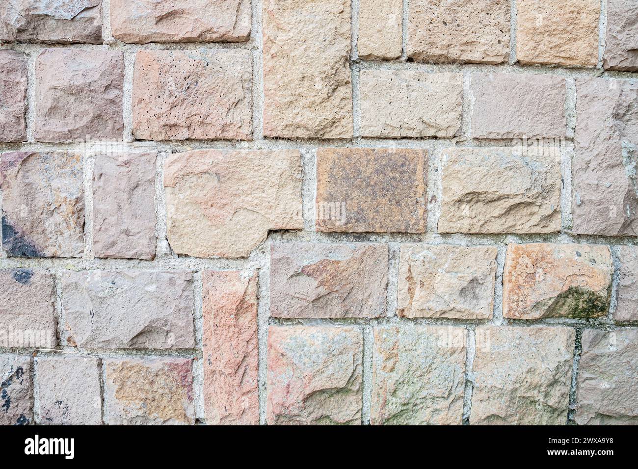 Wall cladding of horizontally arranged stones. Selective focus with ...