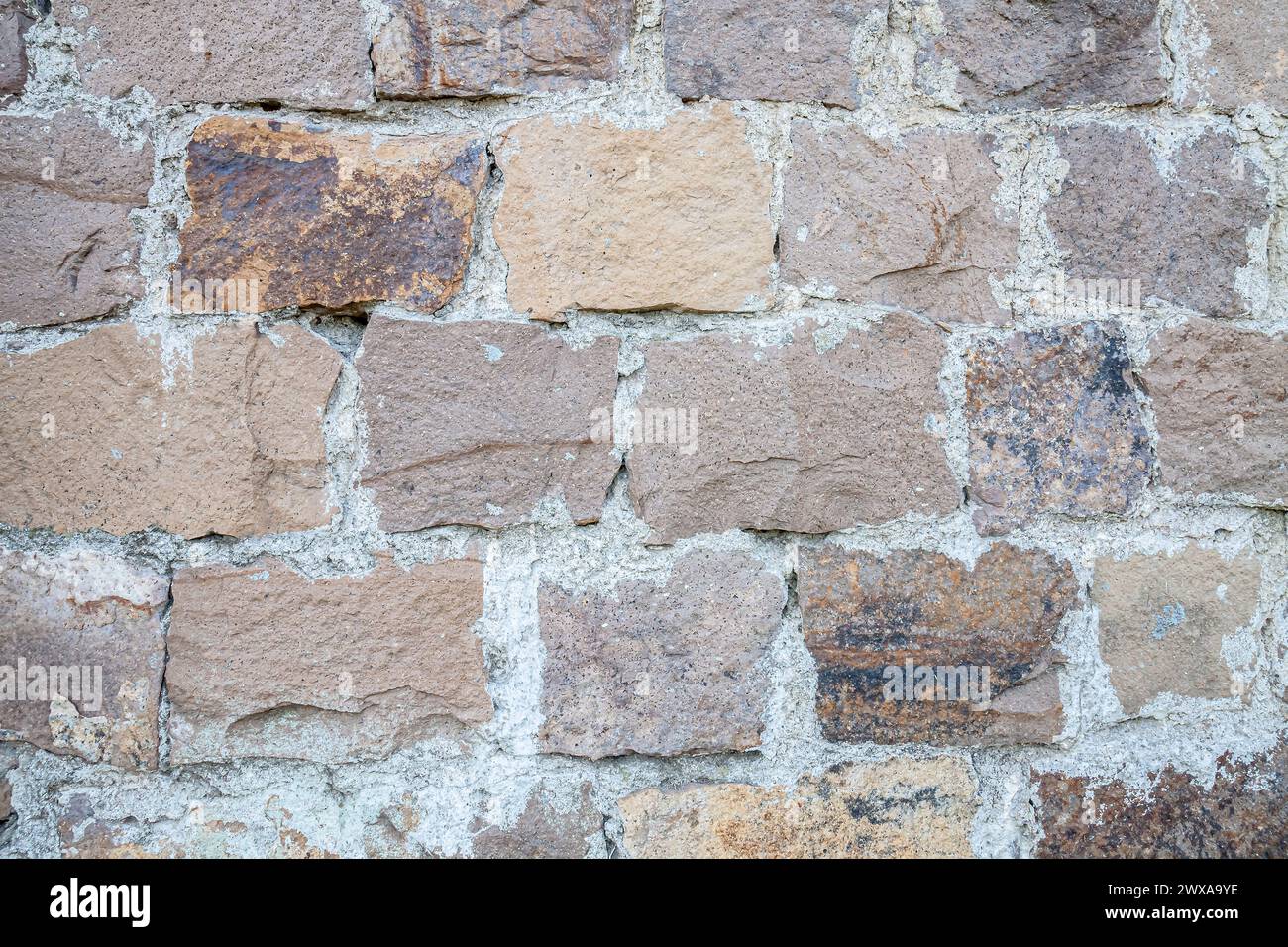 Wall cladding of horizontally arranged stones. Selective focus with ...